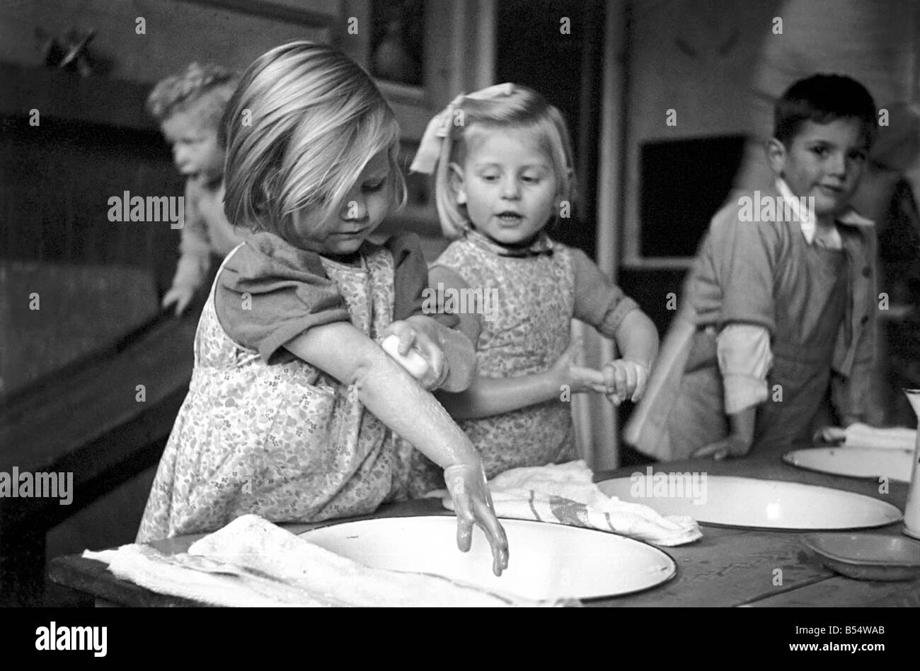 Three Children Washing: Huh! Women! Just look at 'em now. They're like ...