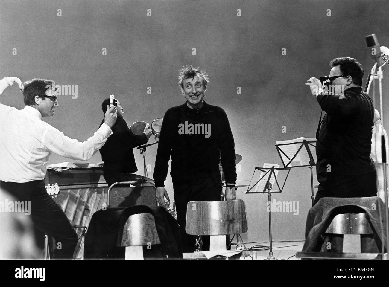 Spike Milligan, Peter Sellers, and Harry Secombe have a mock duel with ...