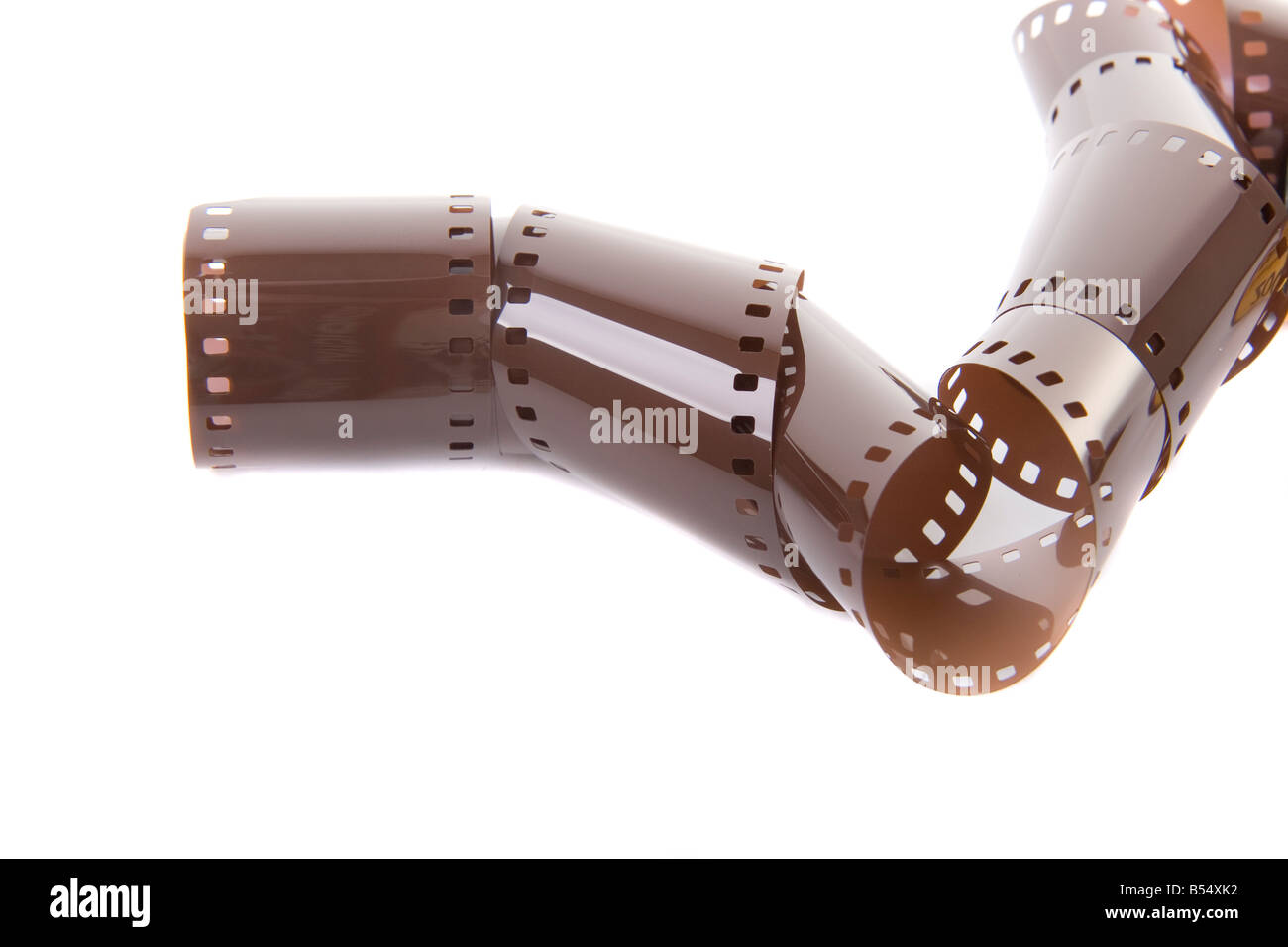 A spool of 35mm camera film unrolling on a white background Stock Photo ...