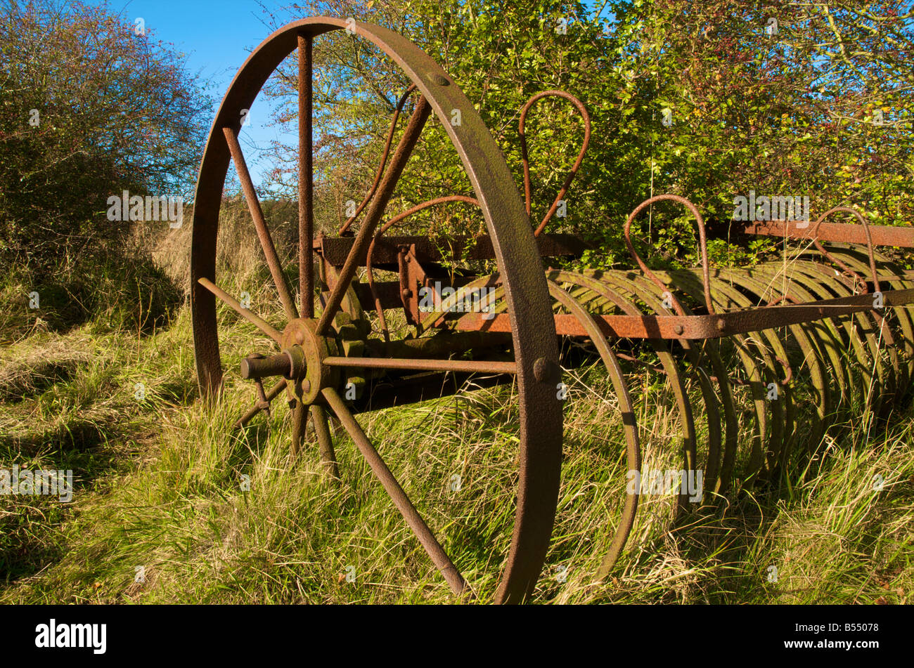 Overgrown old farm equipment hi-res stock photography and images - Alamy