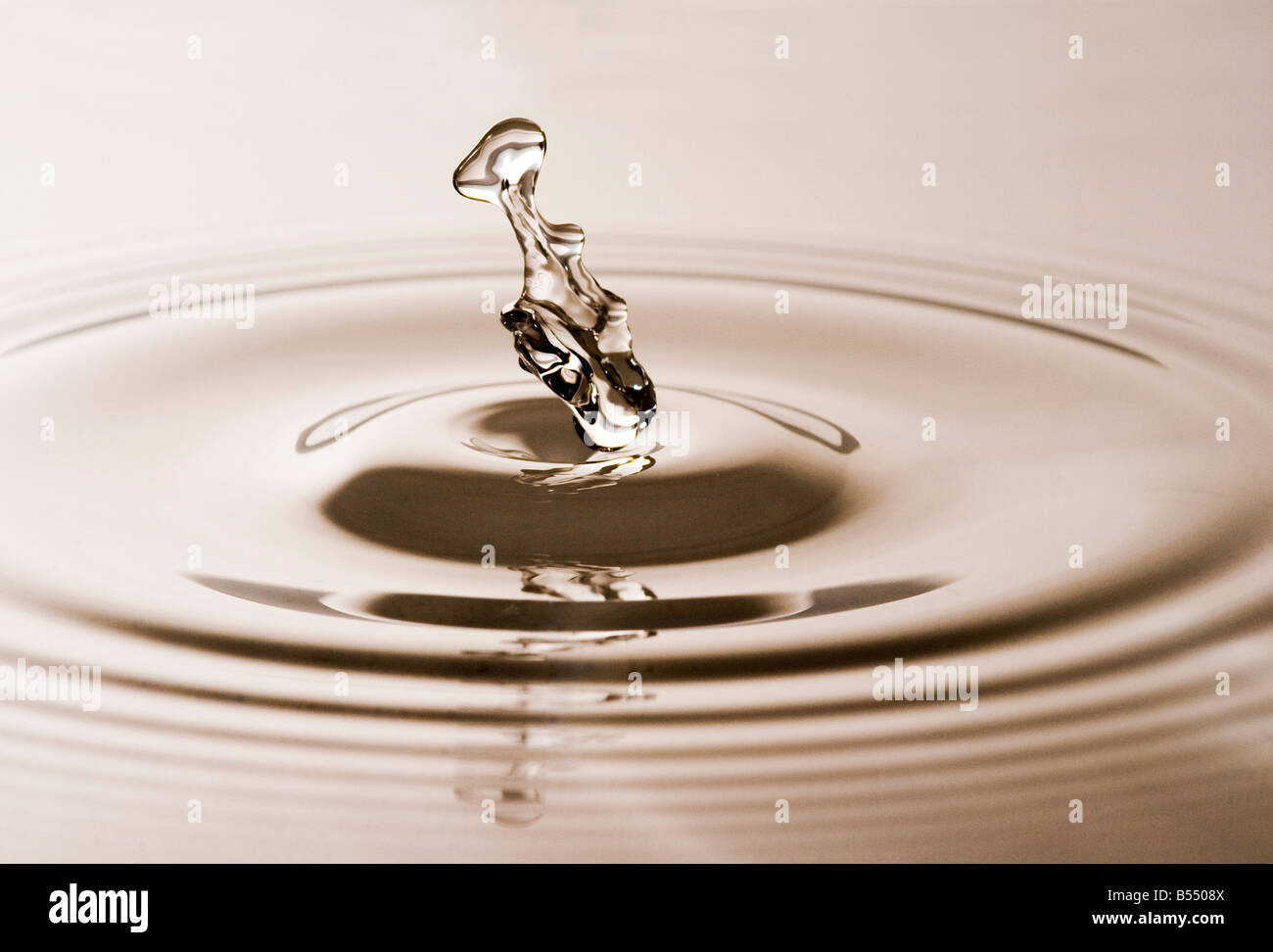Water droplet splash creating a water sculpture Stock Photo - Alamy