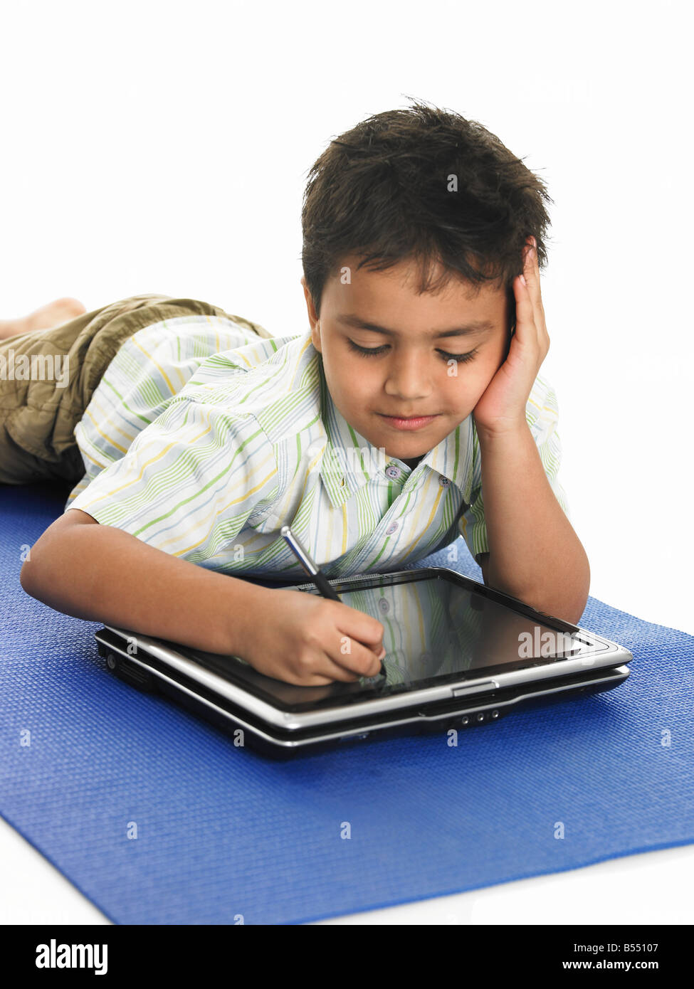 Asian boy of indian origin with his laptop Stock Photo - Alamy