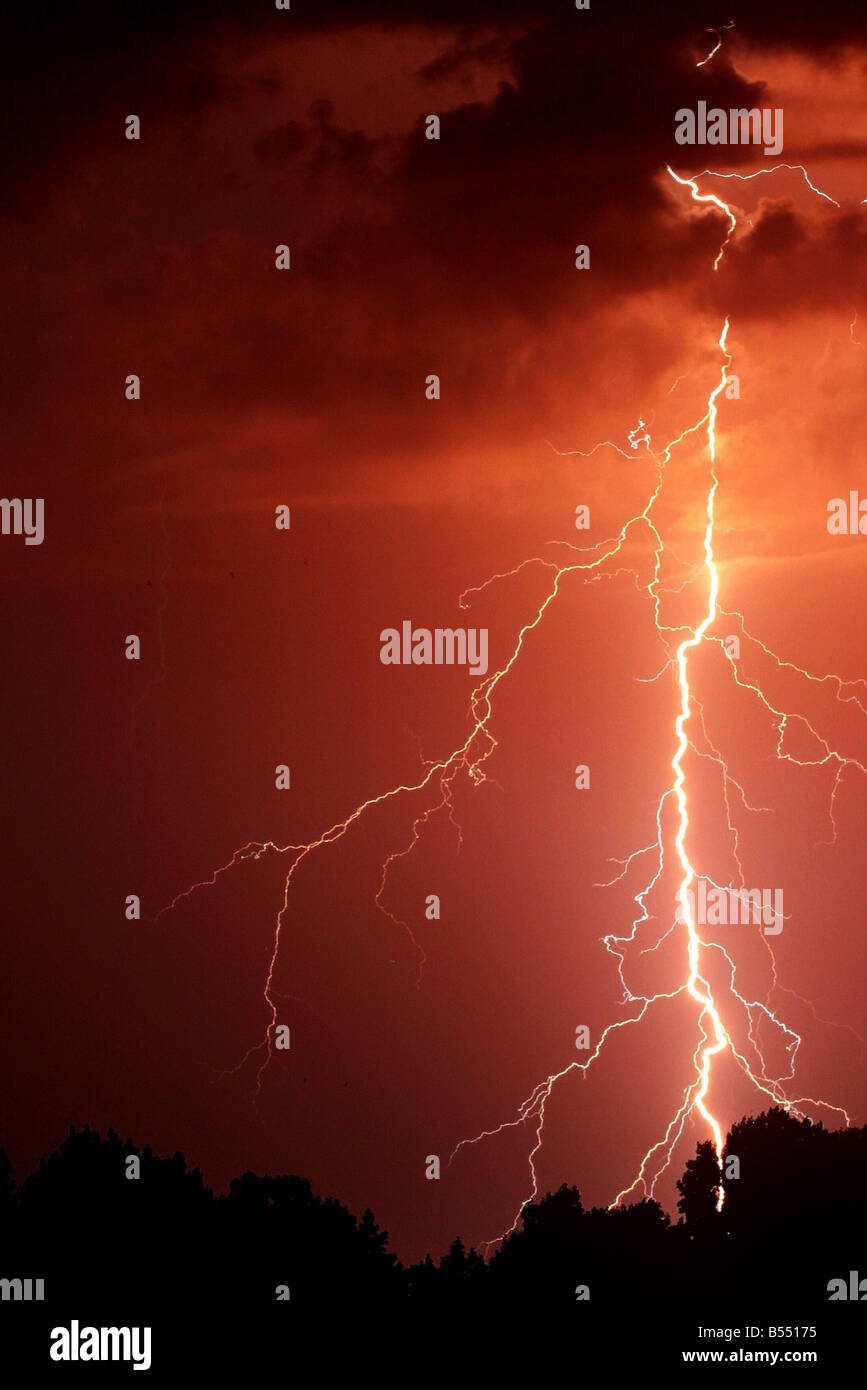 A bolt of lightning touches earth from the sky Stock Photo - Alamy