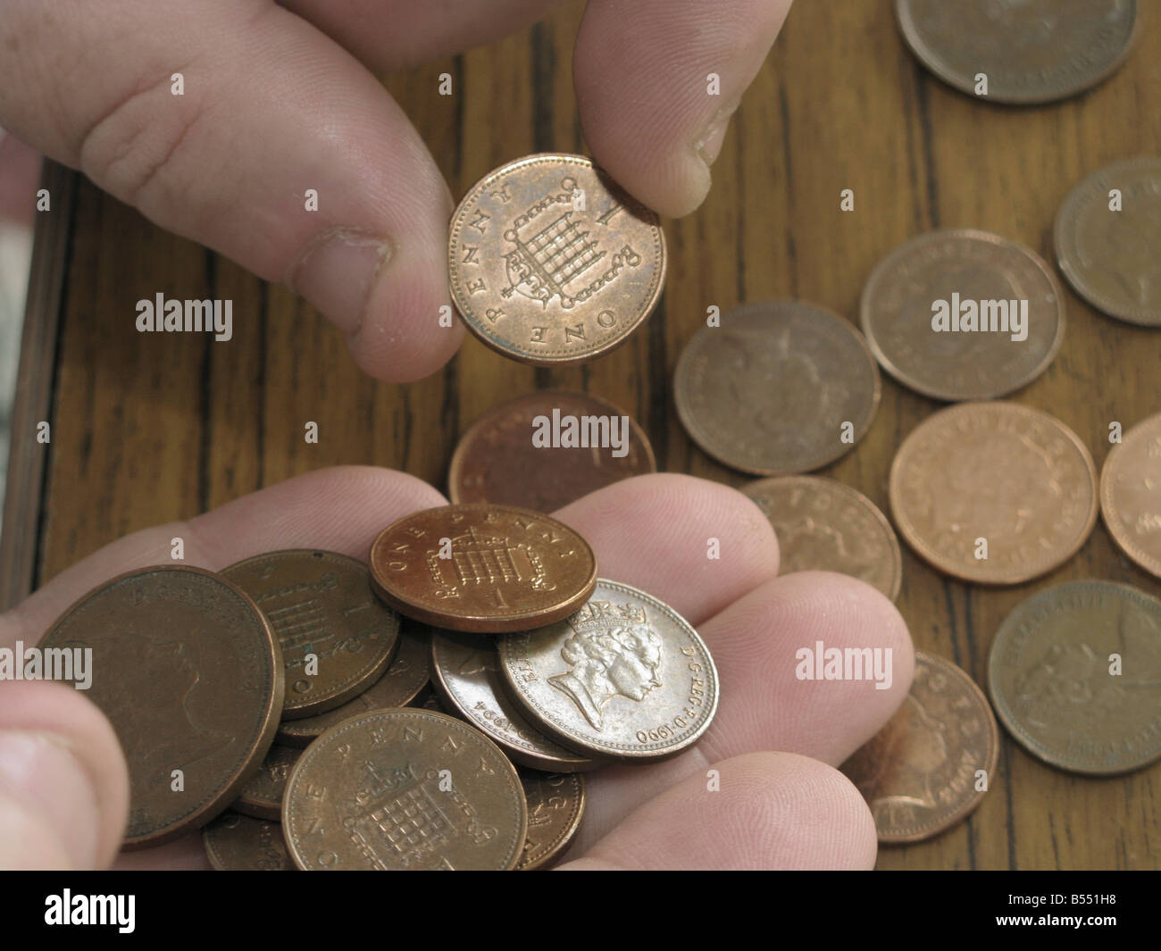 man counting the pennies Stock Photo - Alamy
