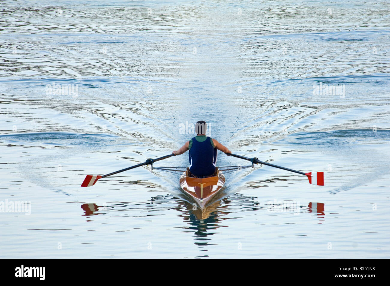 A single rower rowing along the Arno river in Florence Stock Photo - Alamy