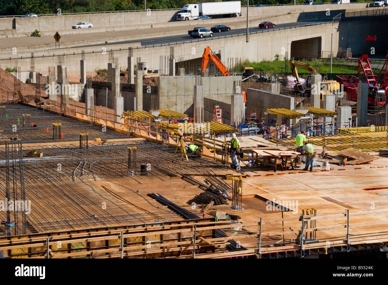 Workers at a construction site Stock Photo - Alamy