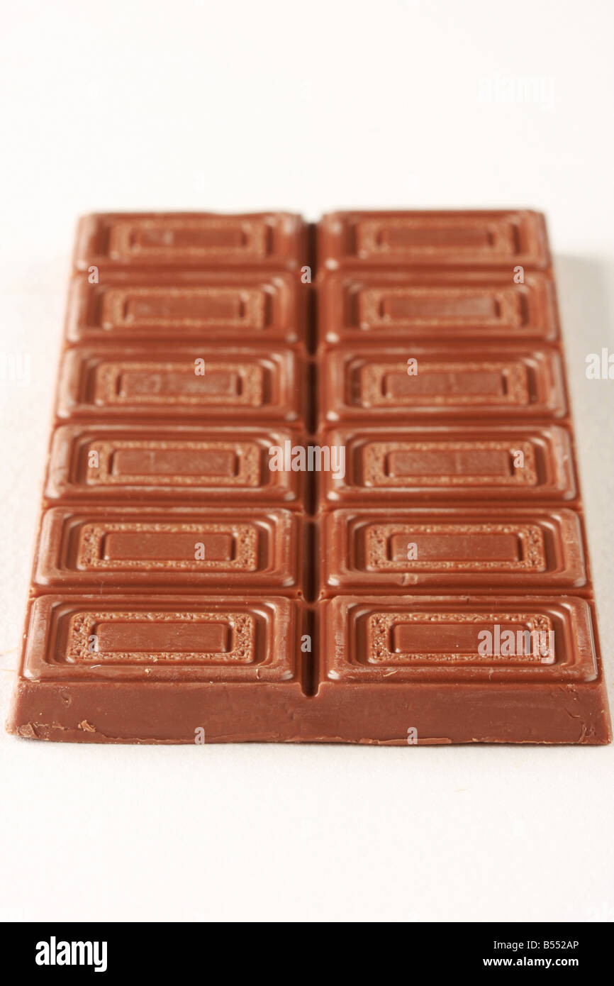 Milk chocolate bar isolated on white shot in studio Stock Photo - Alamy
