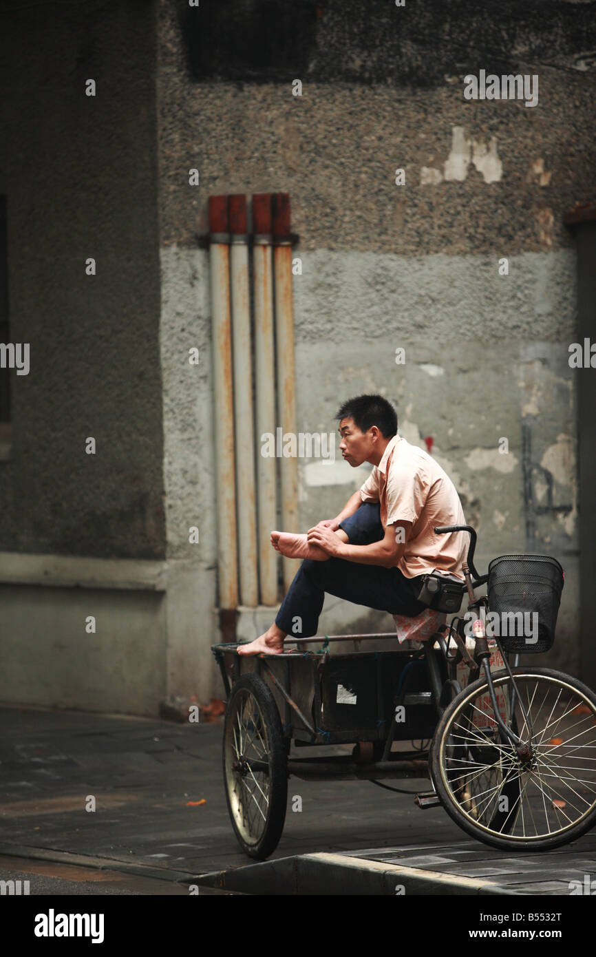 Rickshaw driver takes a break, French Concession, Shanghai Stock Photo ...