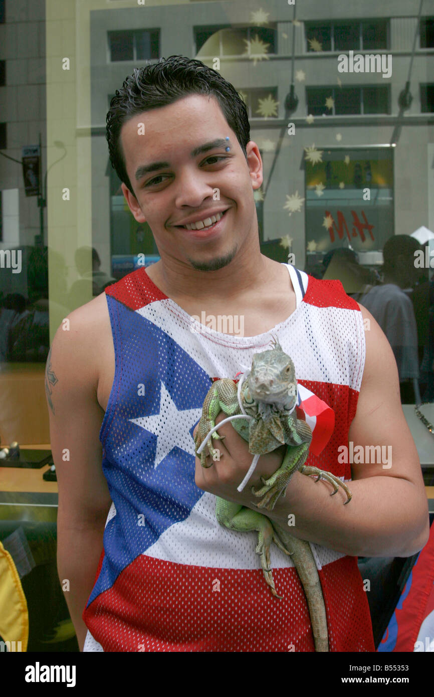 Puerto Rican Day Parade Young man with iguana watching the parade in ...