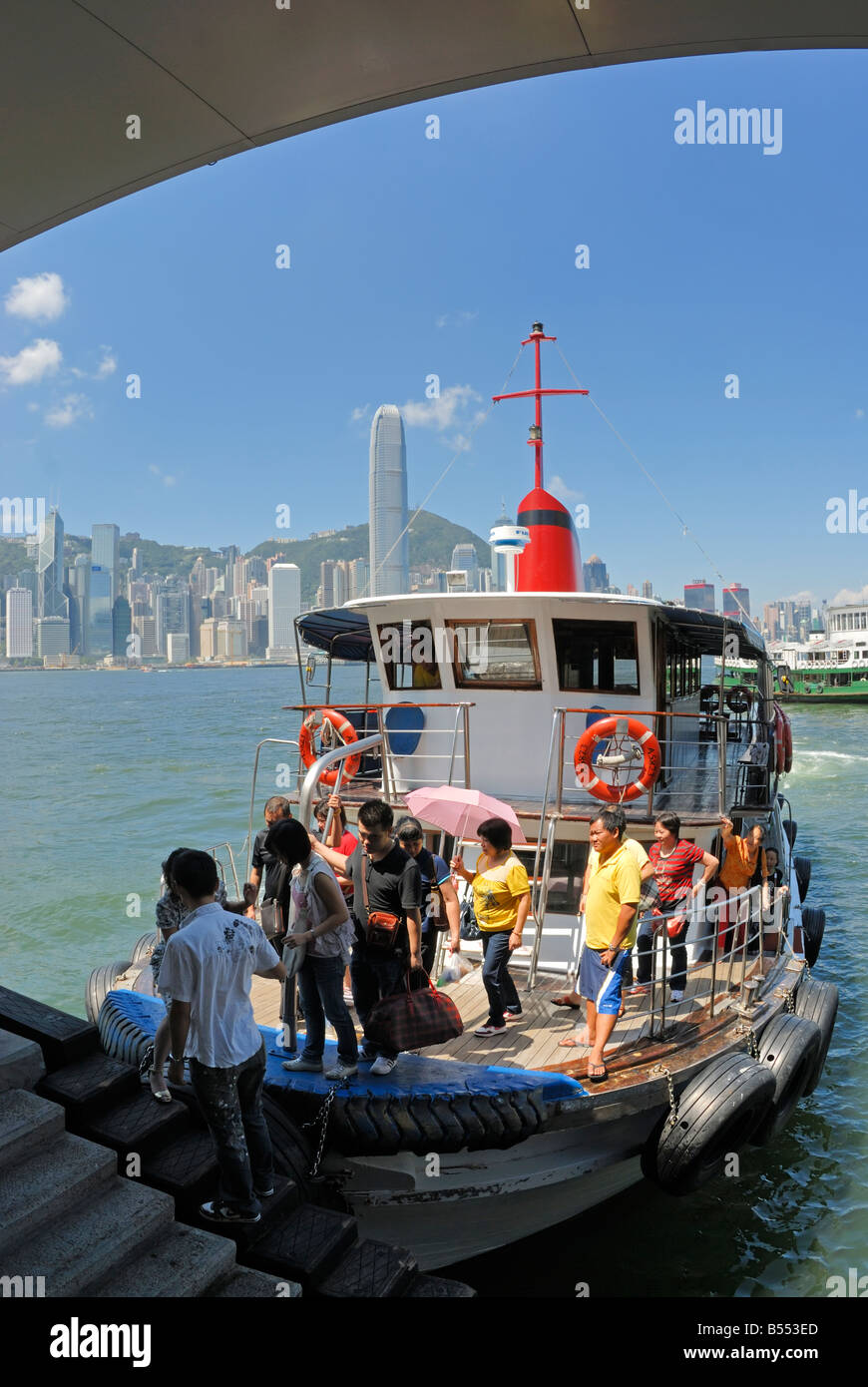 Ferry unloading passengers, Hong Kong harbour Stock Photo - Alamy