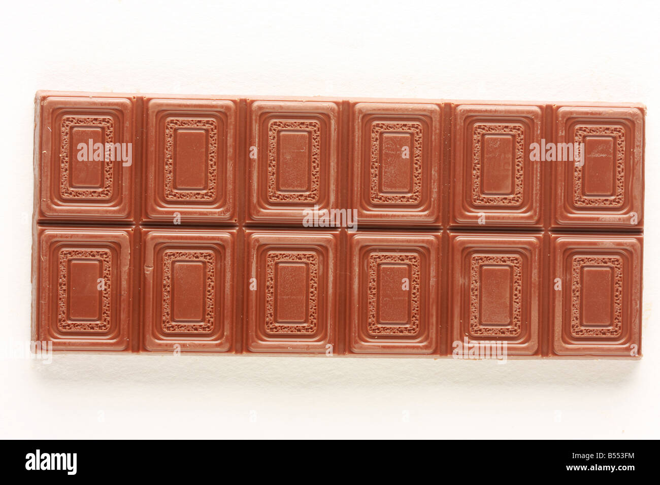 Milk chocolate bar isolated on white shot in studio Stock Photo - Alamy