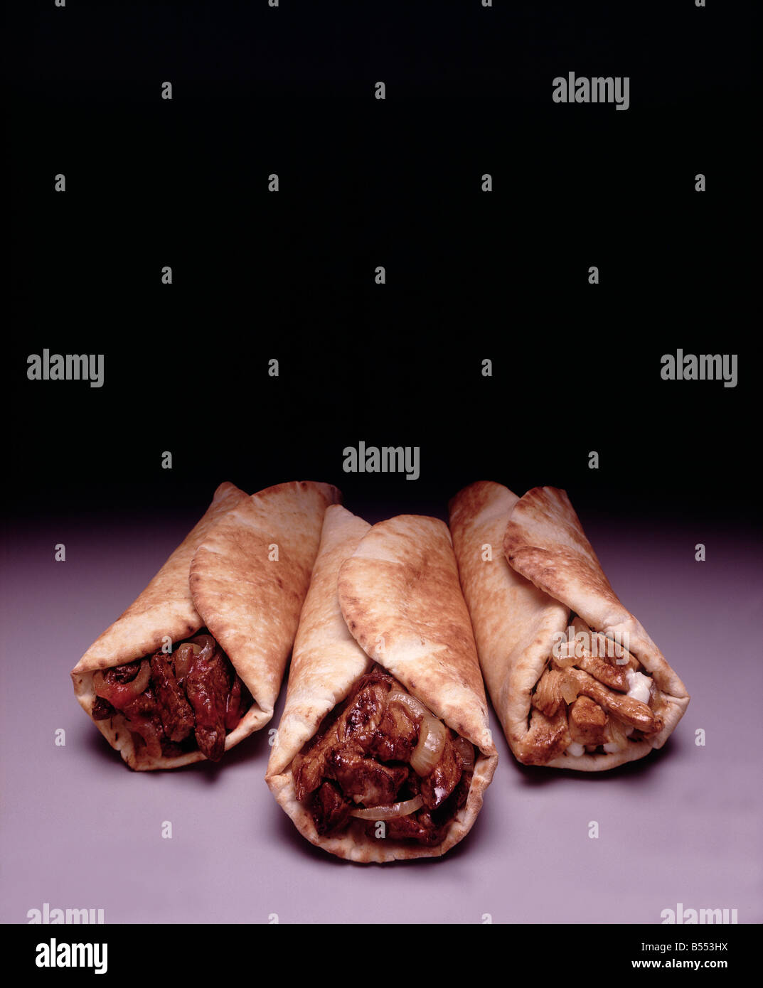 Chicken, beef and lamb gyros wraps Stock Photo - Alamy