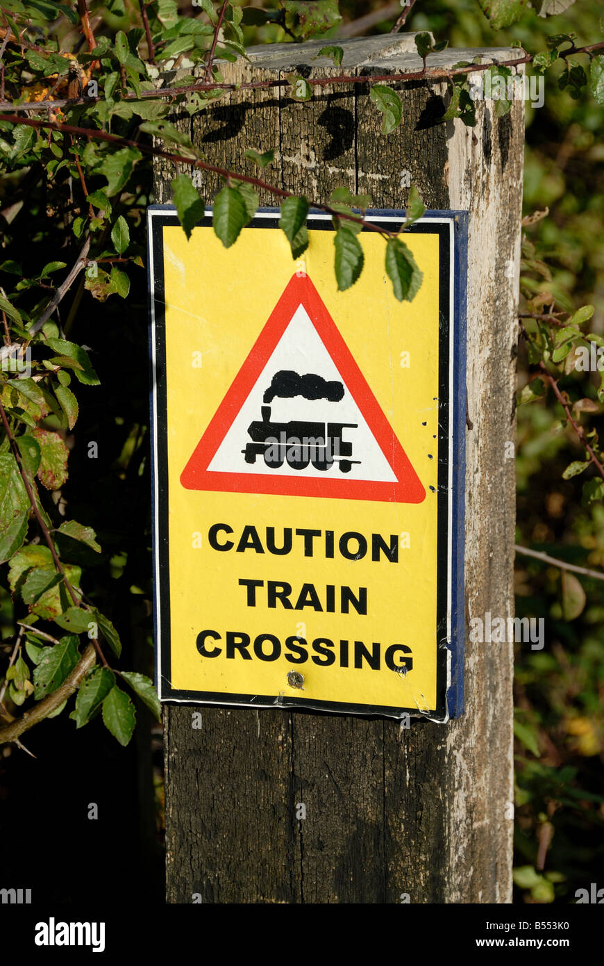 Caution train crossing sign Stock Photo - Alamy