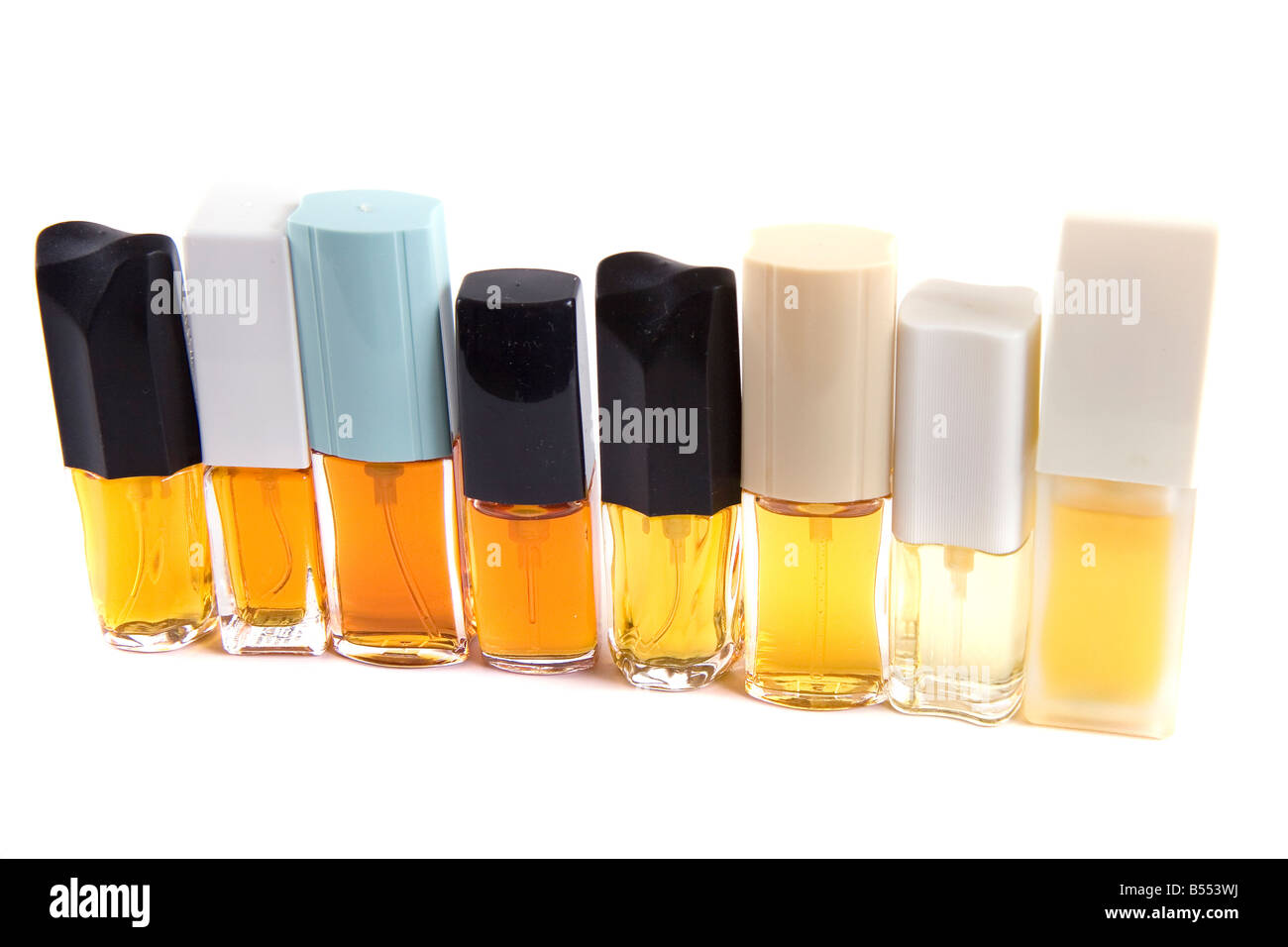 A row of colorful perfume bottles isolated on white Stock Photo - Alamy