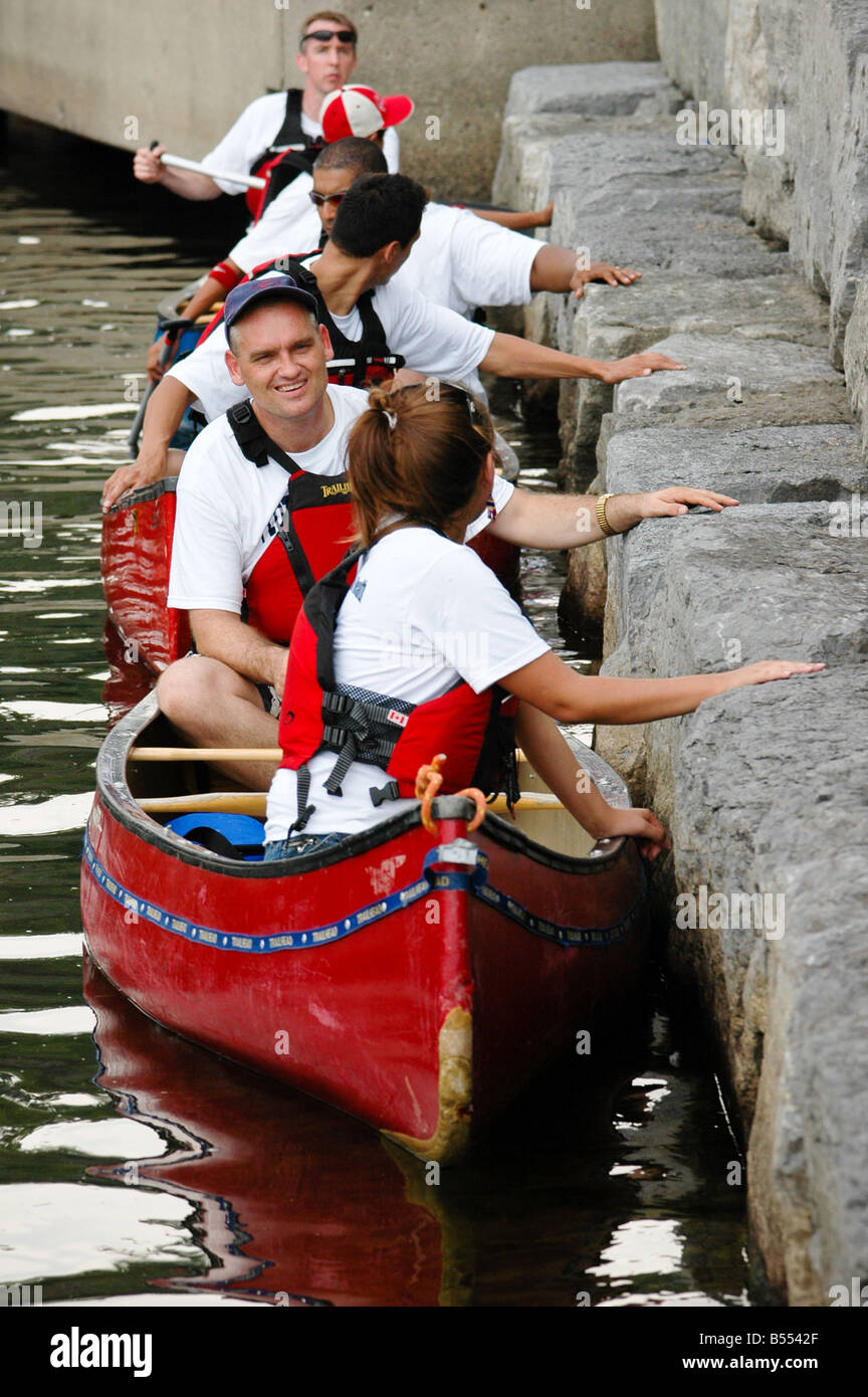 A group of people having fun canoeing together Stock Photo - Alamy