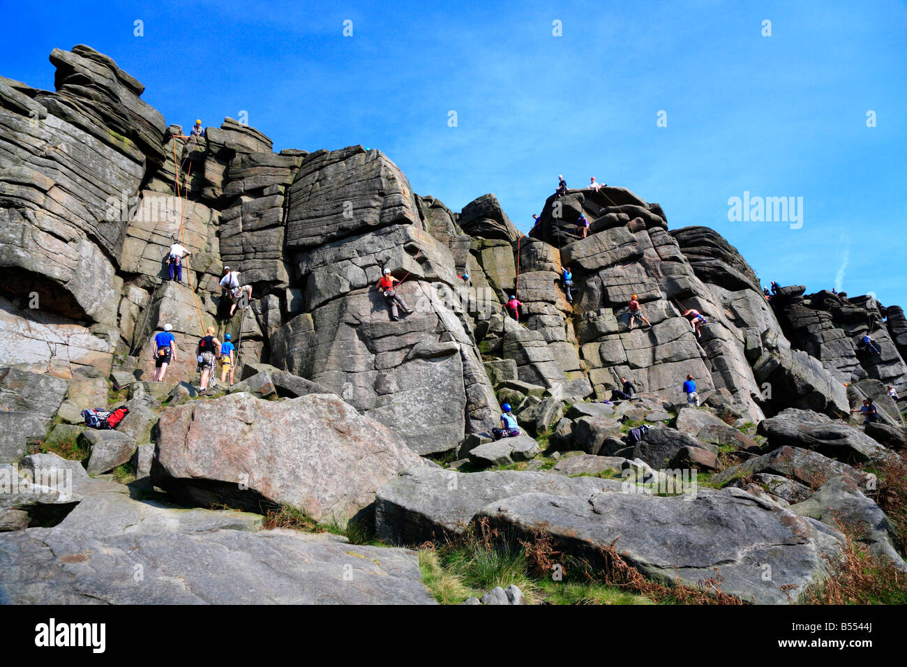 Rock climbers on Stanage Edge near Hathersage, Derbyshire, Peak ...