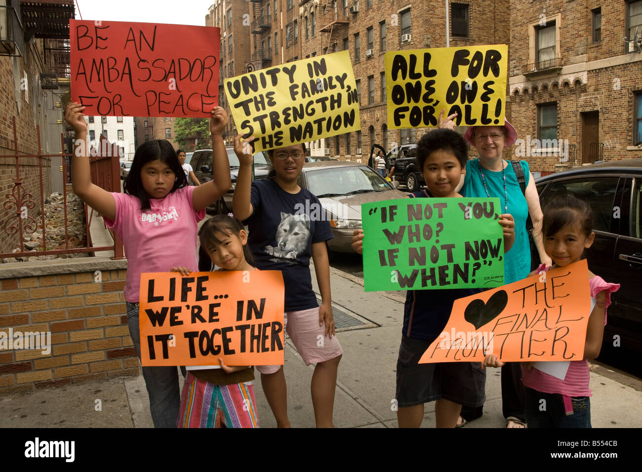 Children with signs ready to march in a religiously based peace parade ...