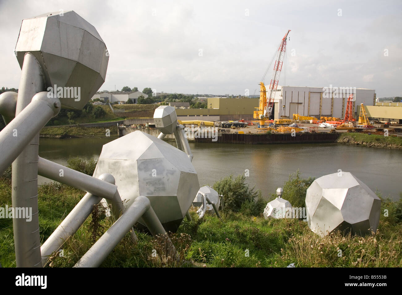 8 foot high steel men statues are by artist Graeme Hopper and stand on ...