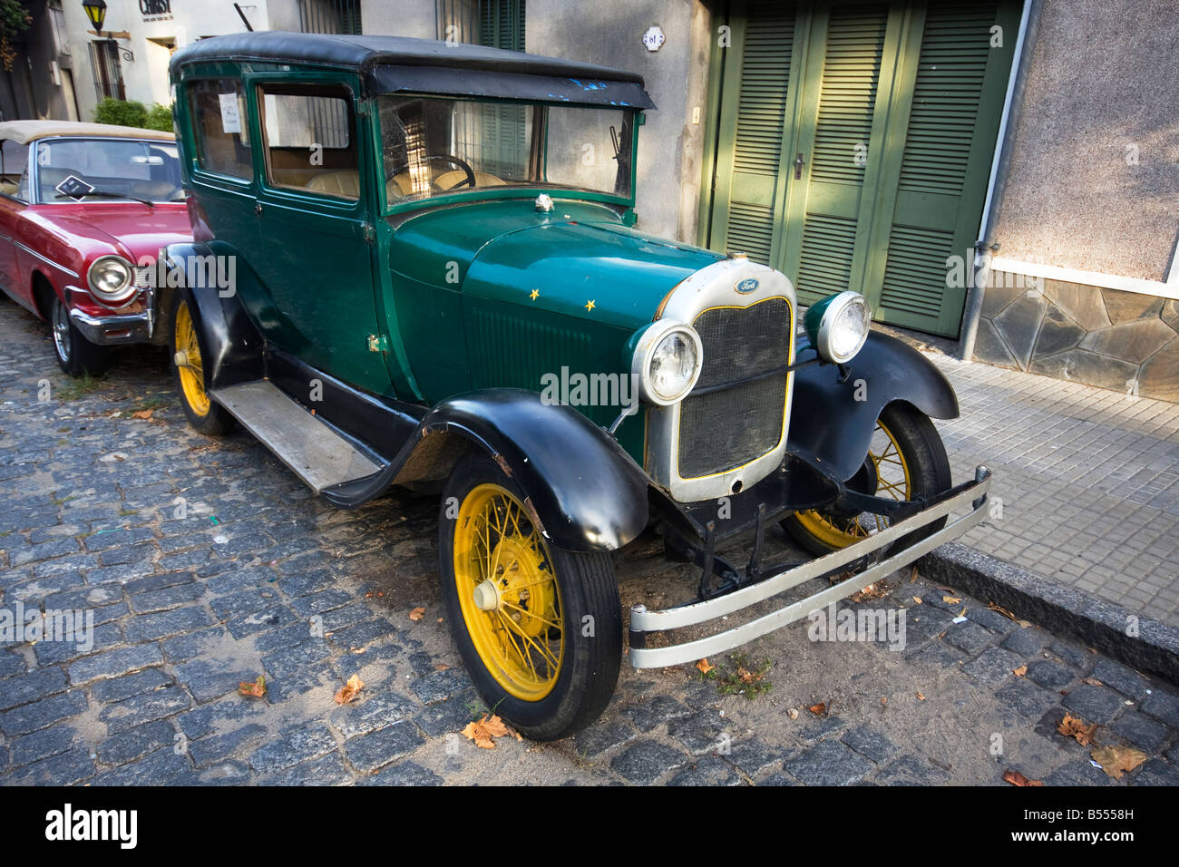 A green classic ford car with a soft top in Colonia del Sacramento ...