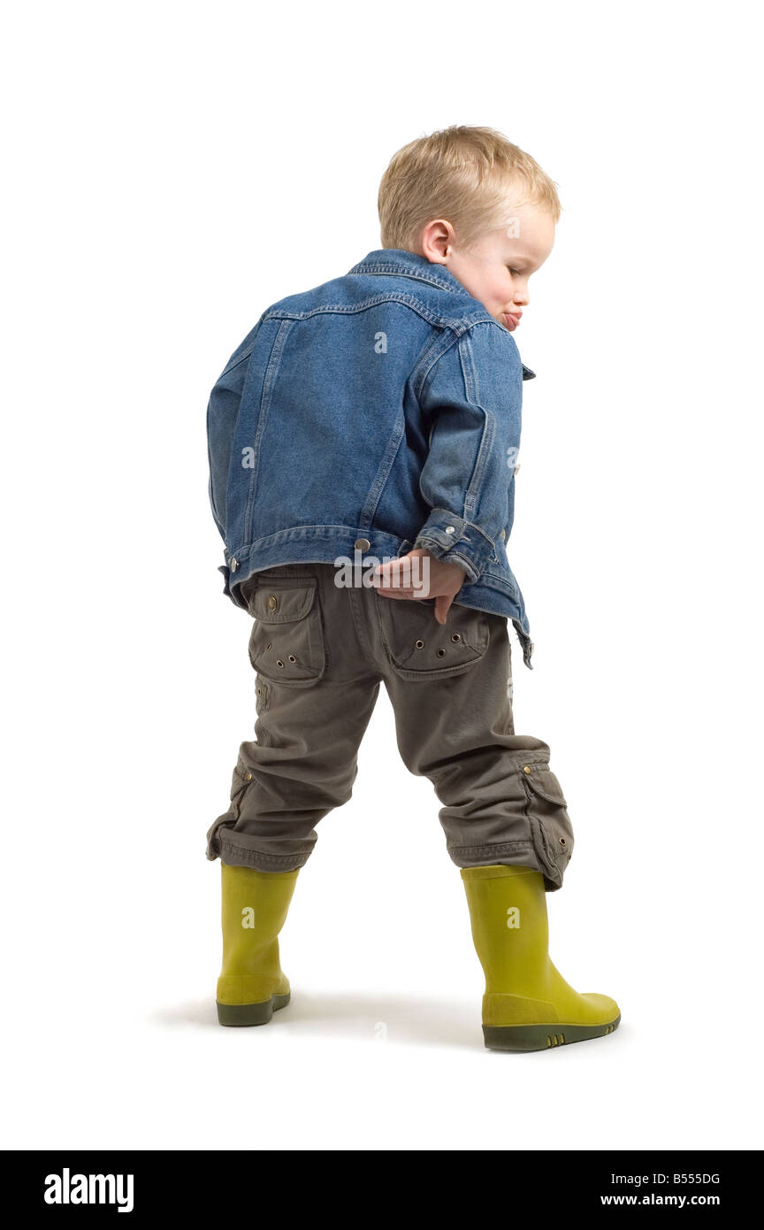 This kid is playing funny sticking out his tongue and showing his butt ...