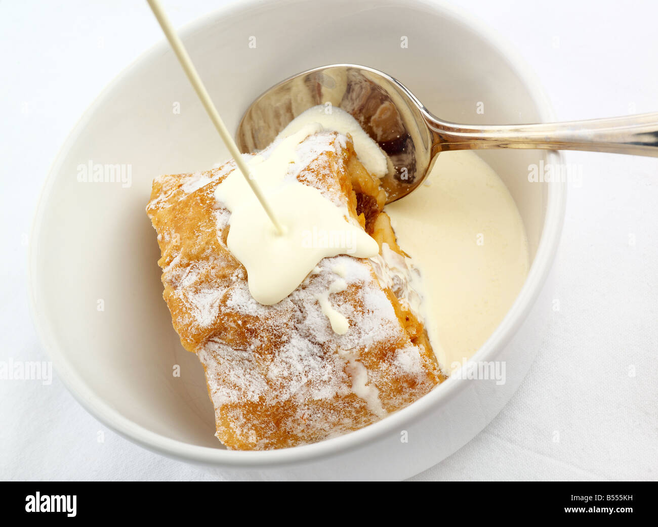Apple Strudel with cream Stock Photo - Alamy