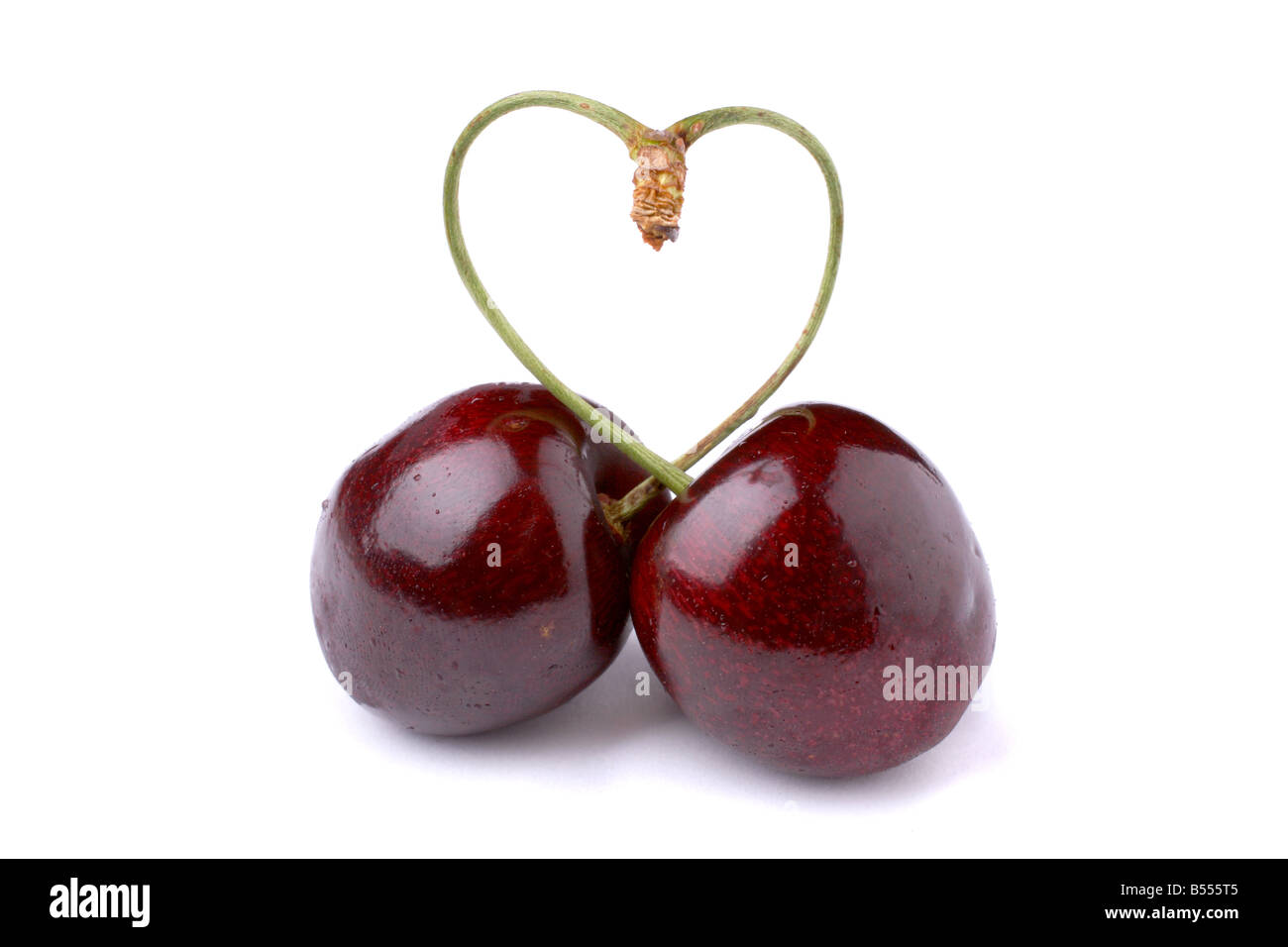 two cherries tied into a heart Stock Photo - Alamy