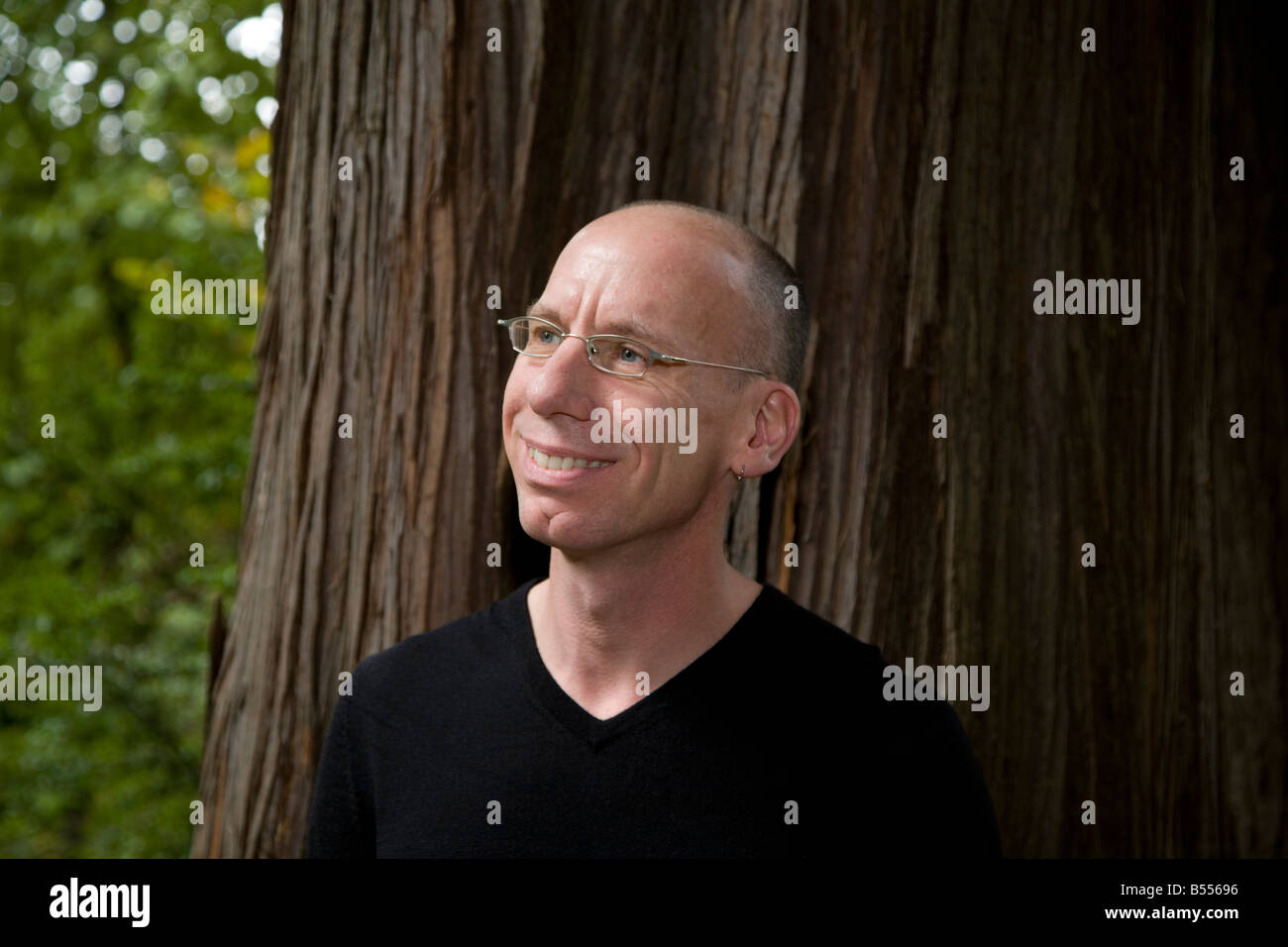 Smiling bald man in glasses hi-res stock photography and images - Alamy