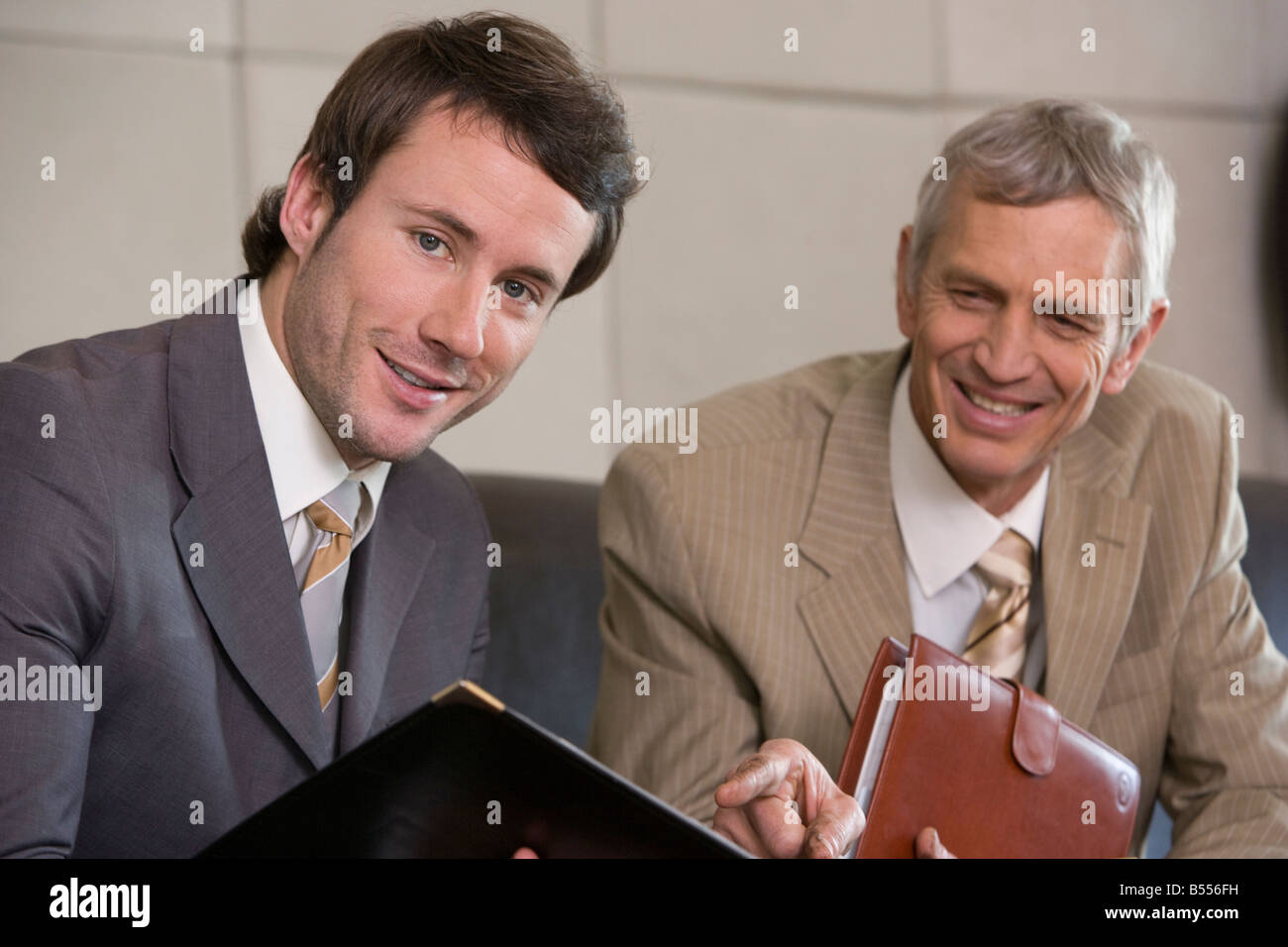 Young businessman with an older office colleague Stock Photo - Alamy