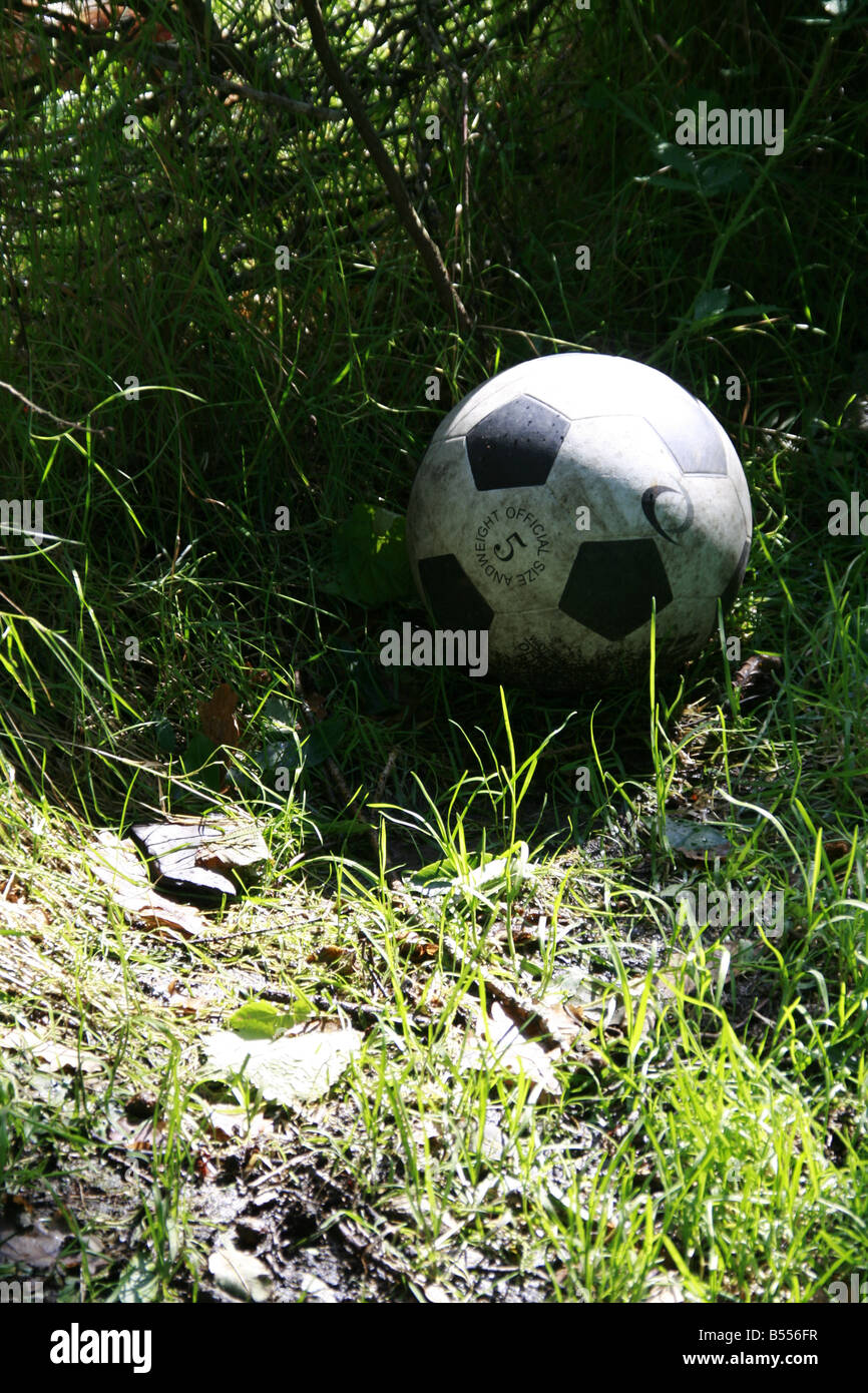 one dirty football in field in sun Stock Photo - Alamy