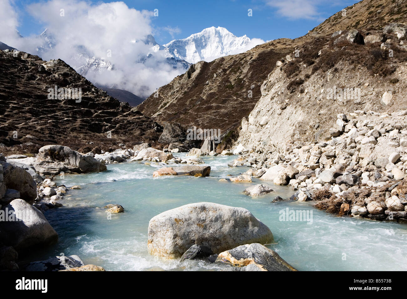 Glacier fed river with Kangtega in the distance, Everest, Nepal Stock ...