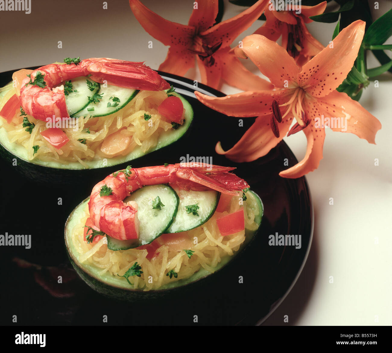 Avocado half stuffed with spaghetti squash and topped with cucumber and ...