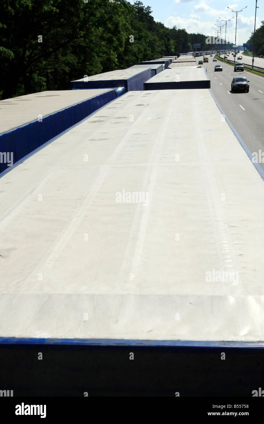 Traffic jam of heavy trucks on highway Stock Photo - Alamy