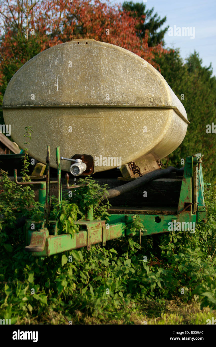 overgrown water tank Stock Photo - Alamy