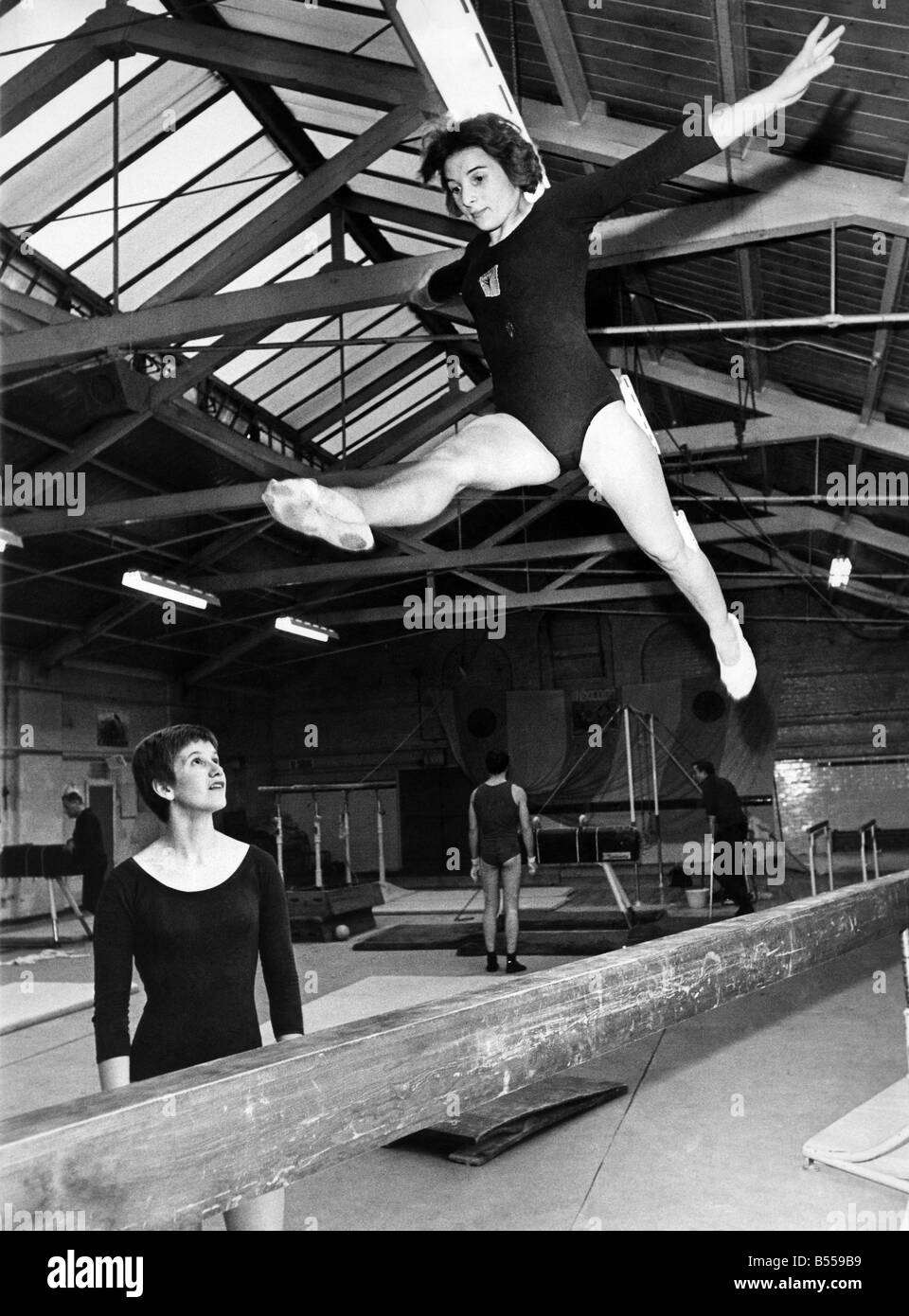 Margaret Bell does a splits jump, Mary Prestidge watches. September ...