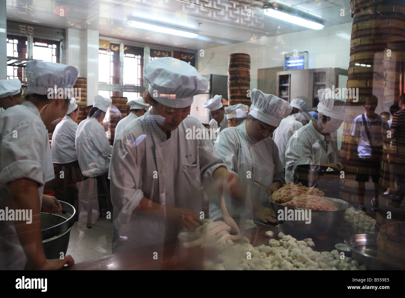 Kitchen staff making Dumplings, Shanghai, China Stock Photo - Alamy