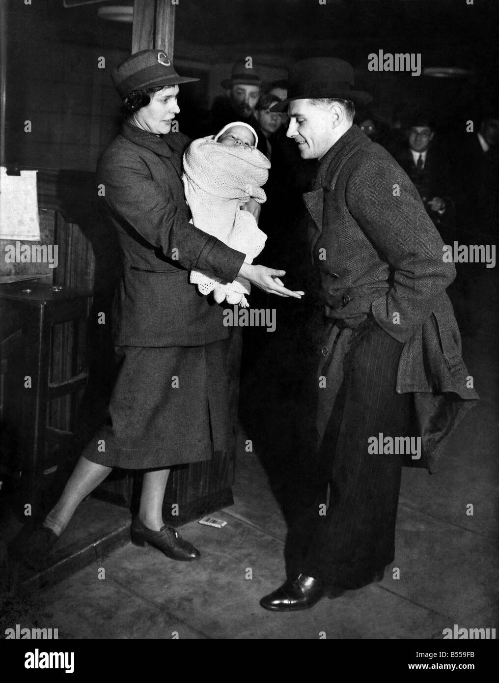 Ticket collector. The woman comes to the rescue she is holding the baby ...