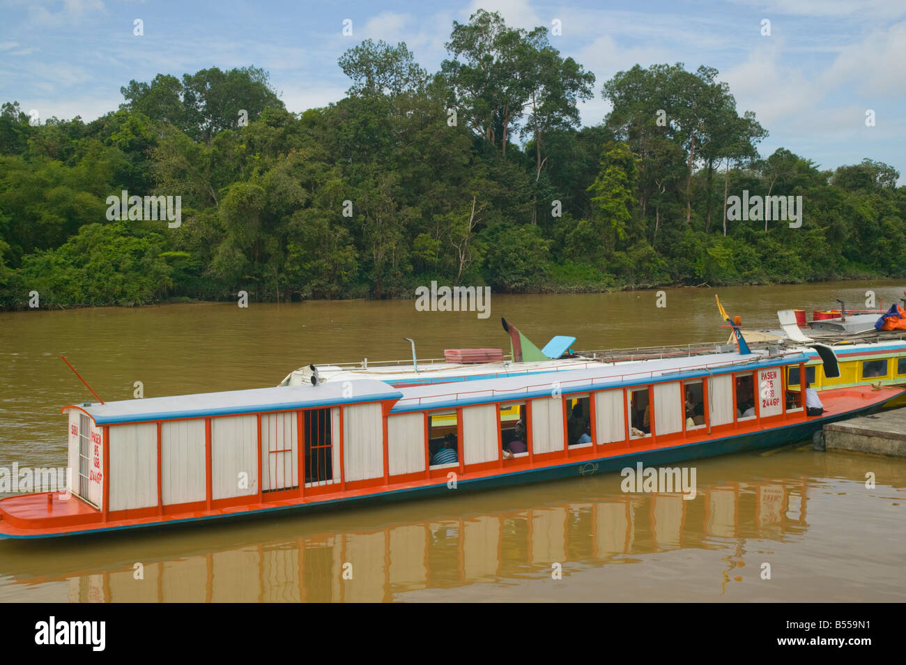 Ferry tied up at the harbour in Kanowit on a tributary of the Rejang ...