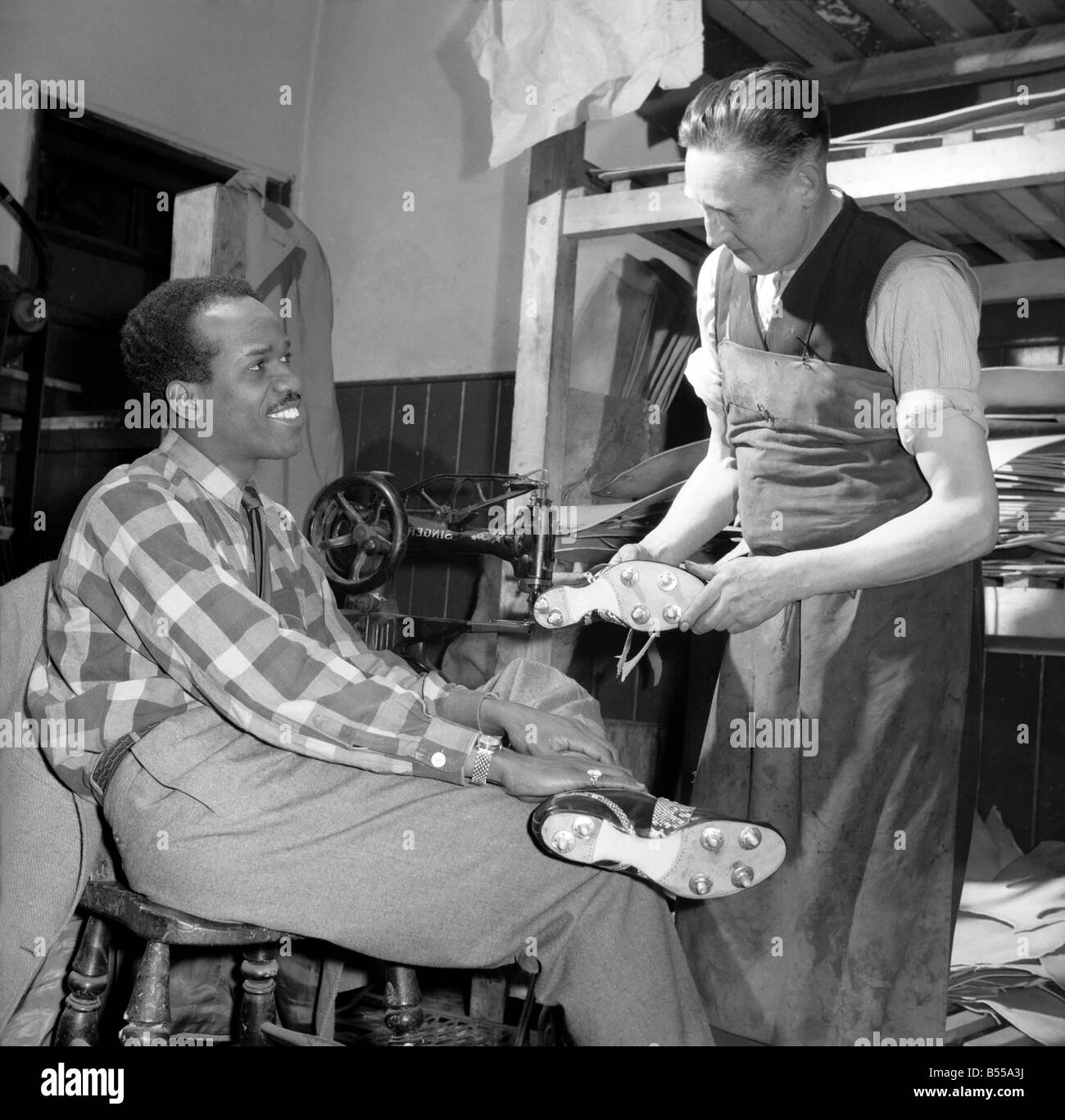 Cobbler seen here making a pair of mens shoes. December 1953 D7262 ...