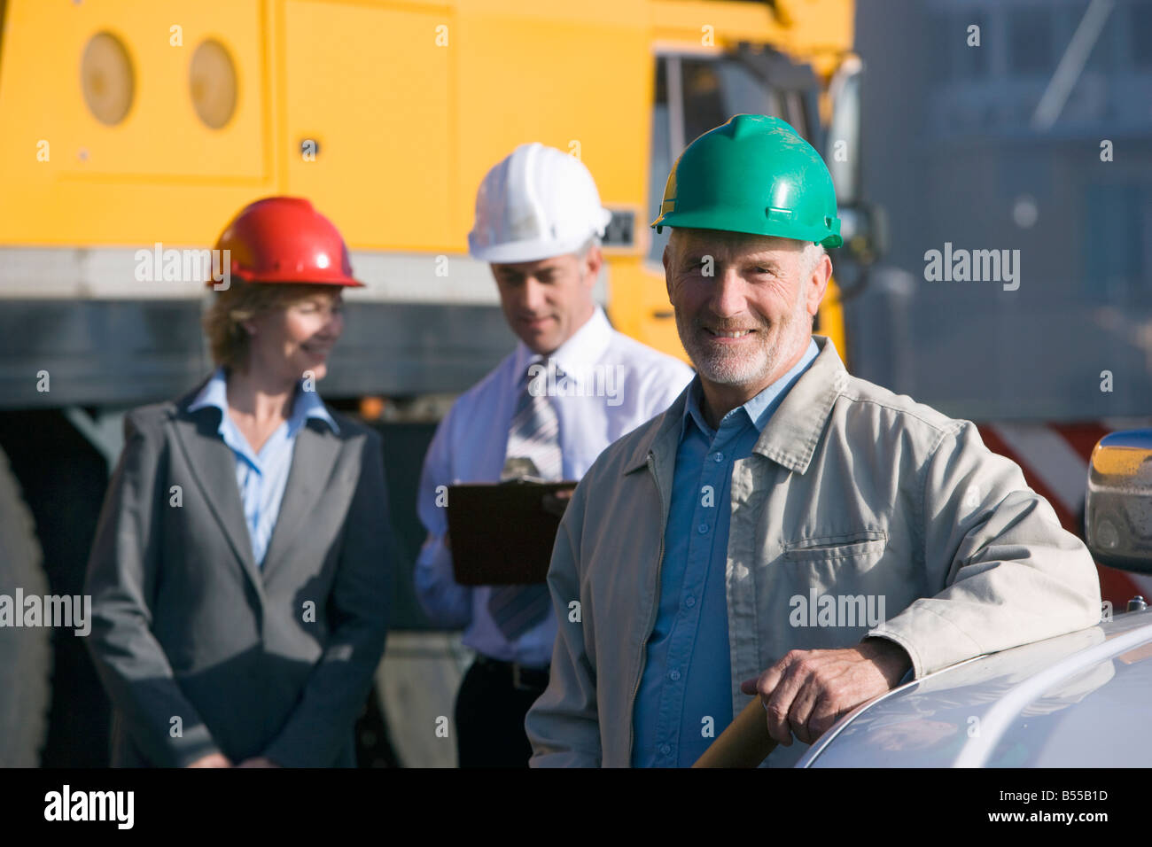 Three construction engineers together on survey Stock Photo - Alamy