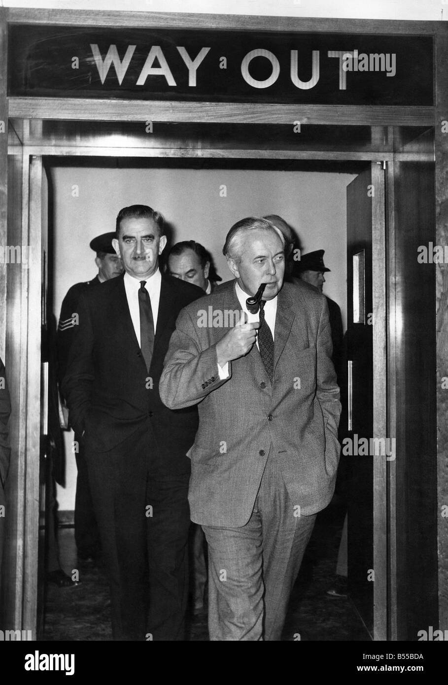 Mr. Harold Wilson and Mr. Herbert Bowden entering the conference room ...