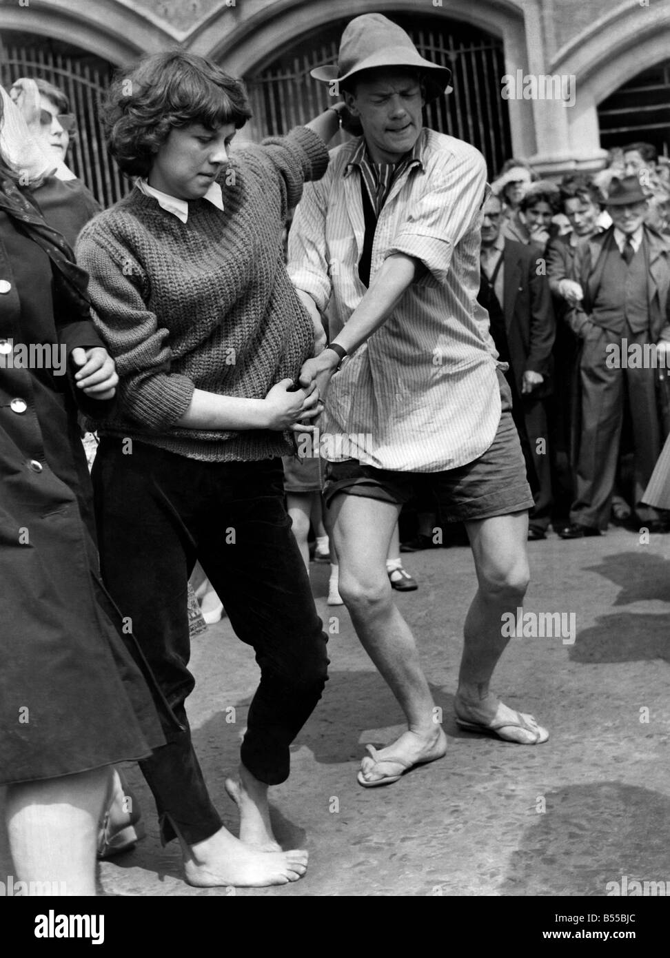 Terry Gray, aged 20 of Crookham, Hants, in shirt and sandals dances ...
