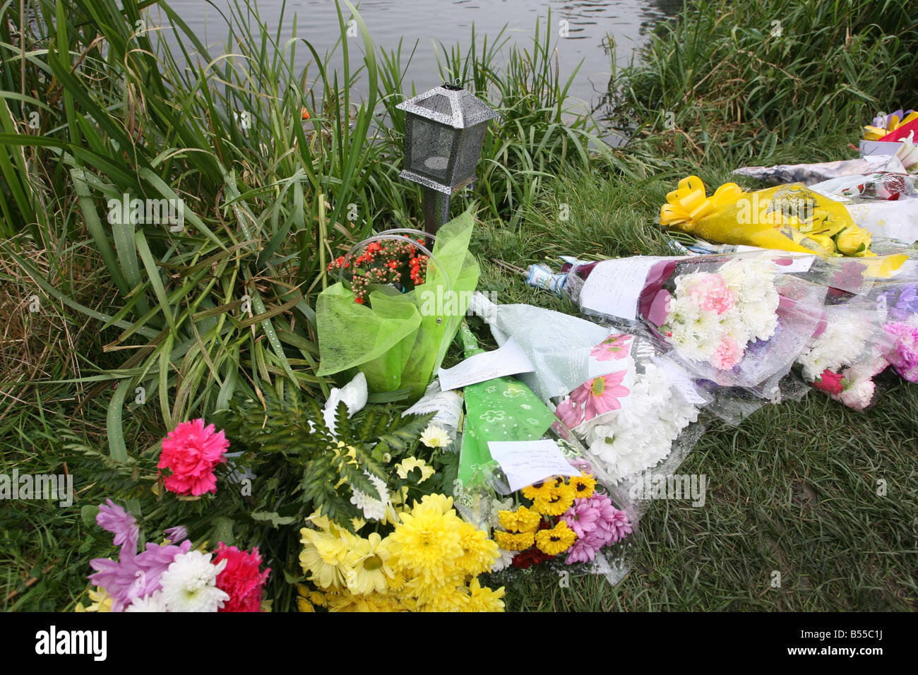 Floral tributes at the pool in Bilston which claimed the life of Shane ...