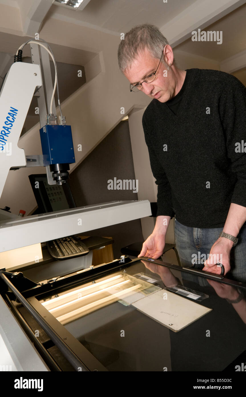 Archivist scanning hi-res stock photography and images - Alamy