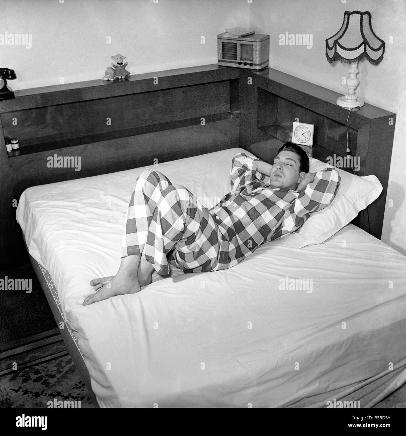 Singer David Hughes sleeping. December 1953 D7611 Stock Photo - Alamy