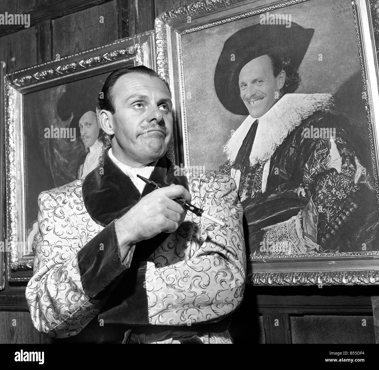 Entertainment: Actor. Terry Thomas in front of a portrait of himself ...