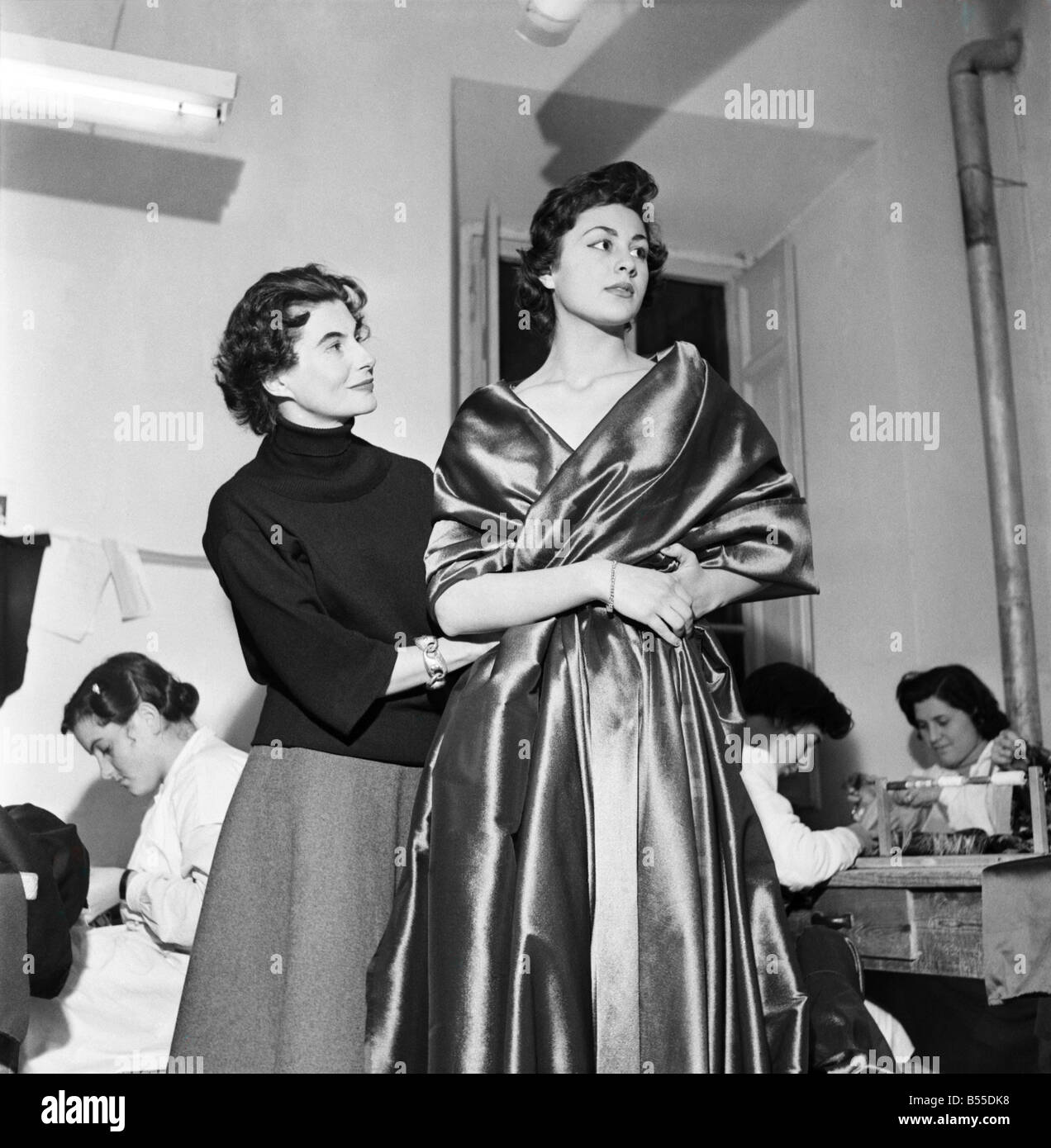 Italy: Fashion. Simonetta Di Cesario, drapes material round model ...