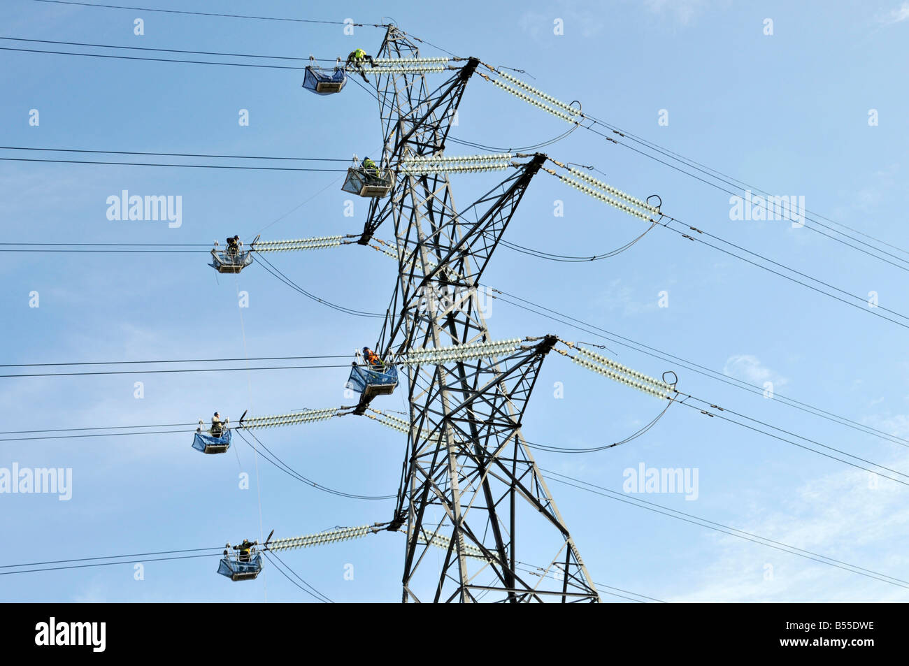 Engineers working on overhead power lines Stock Photo - Alamy