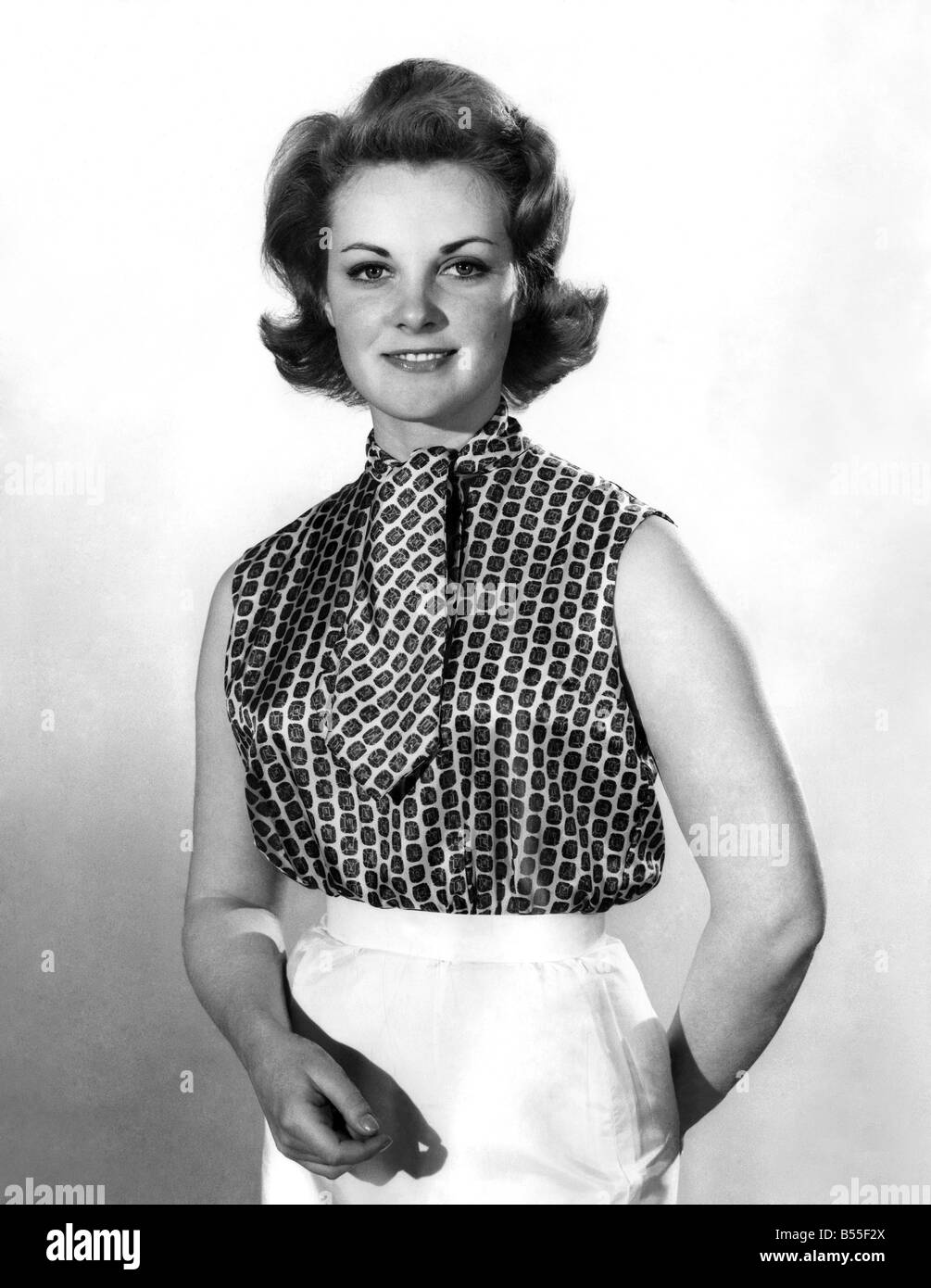 Model Roma Reeves wearing a sleeveless paterned shirt and matching tie ...