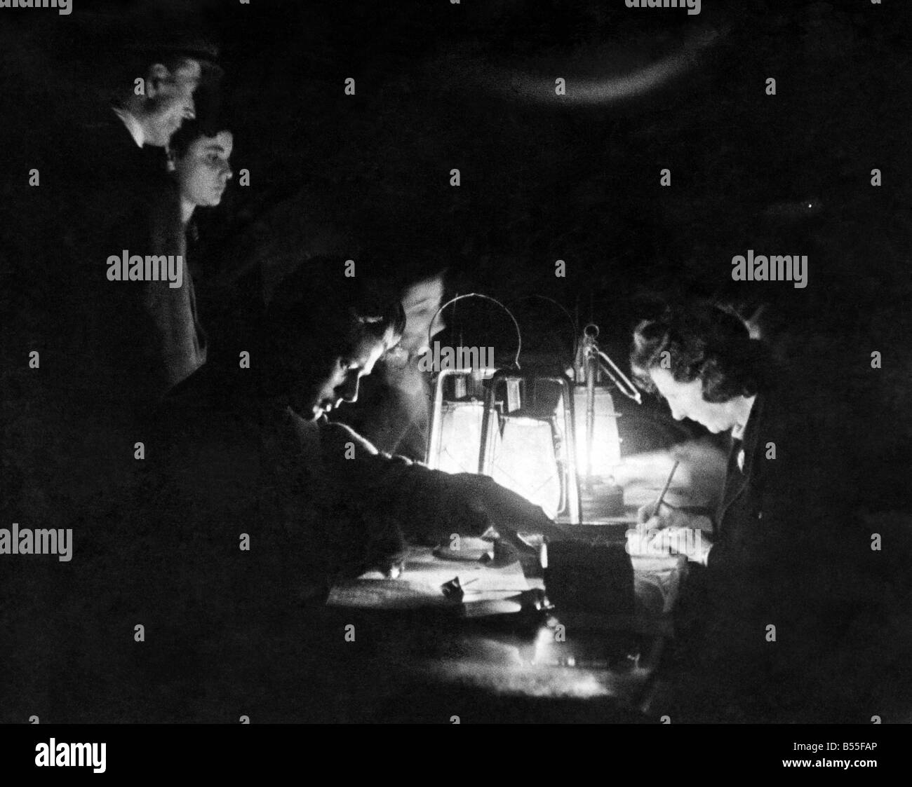 A W.V.S. incident enquiry. Working by the light of Hurricane lamps ...