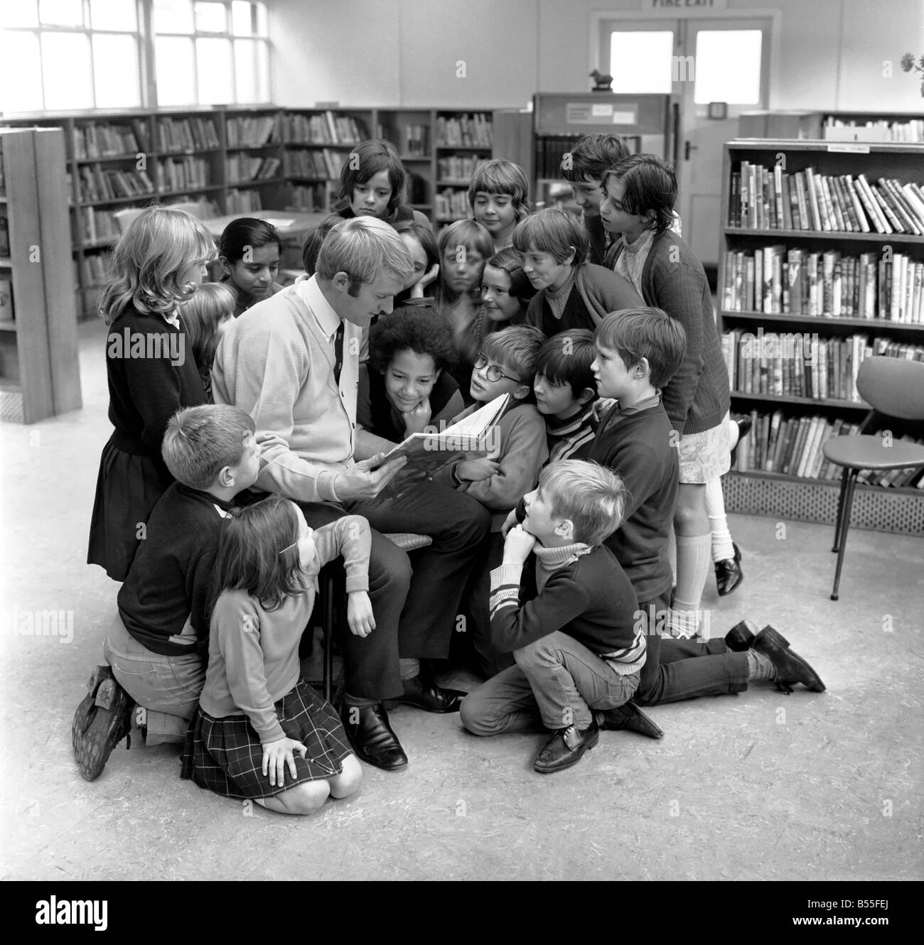Blackburn Rovers footballer Ken Knighton pictured reading stories to a ...